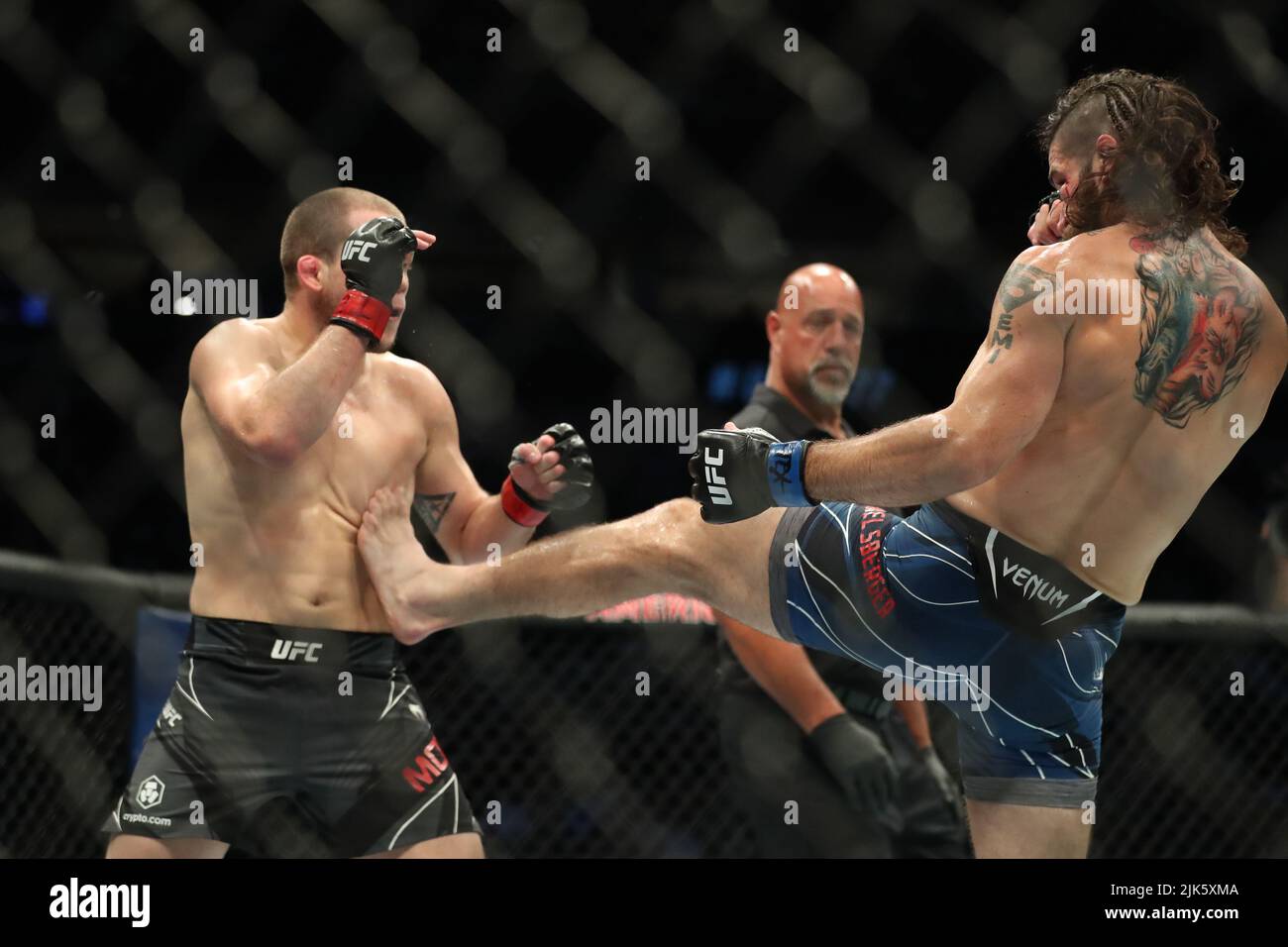 DALLAS, TX - JULY 30: (R-L) Matthew Semelsberger kicks Alex Morono in ...