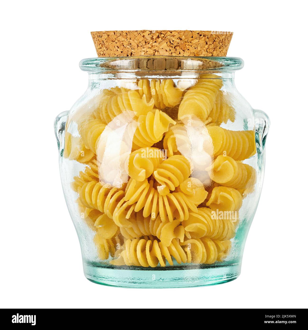 Pasta close-up. Fusilli spirale in a glass jar, isolated on white ...