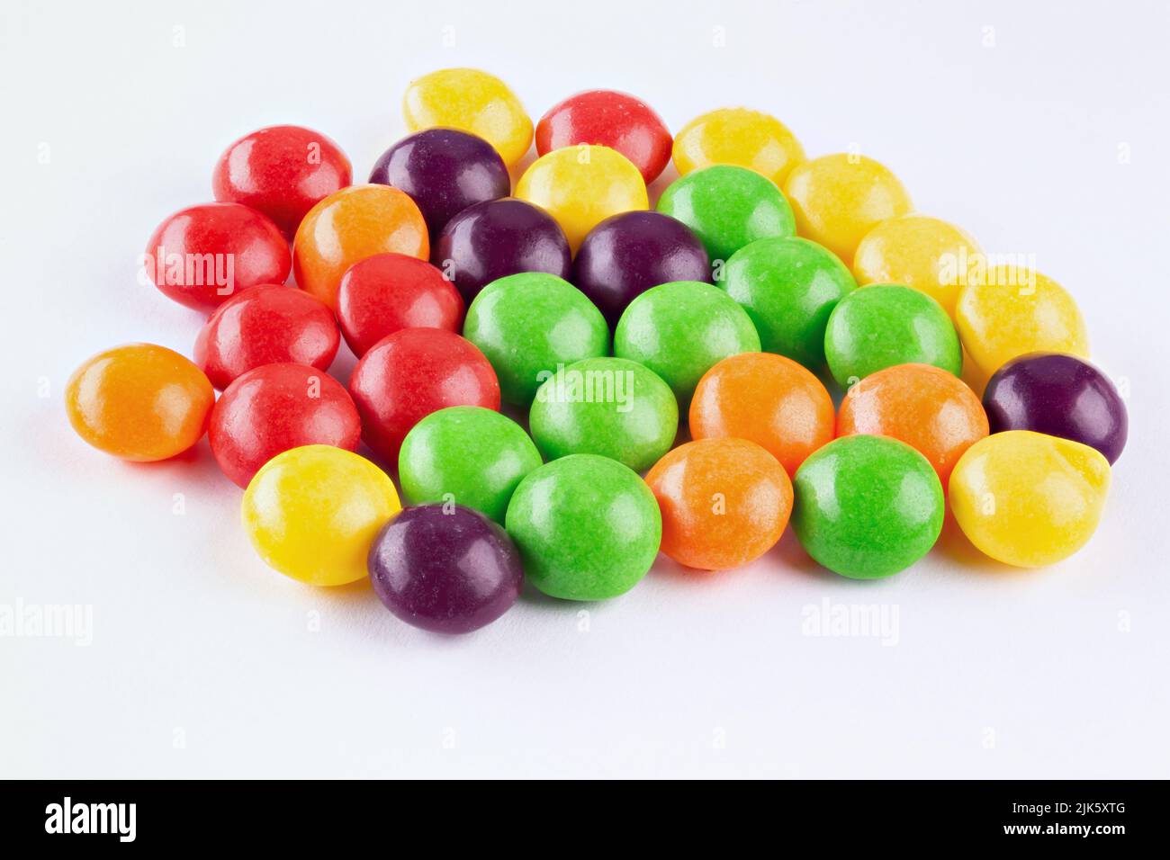 Colorful chocolate buttons, on white background. Chocolate coated ...