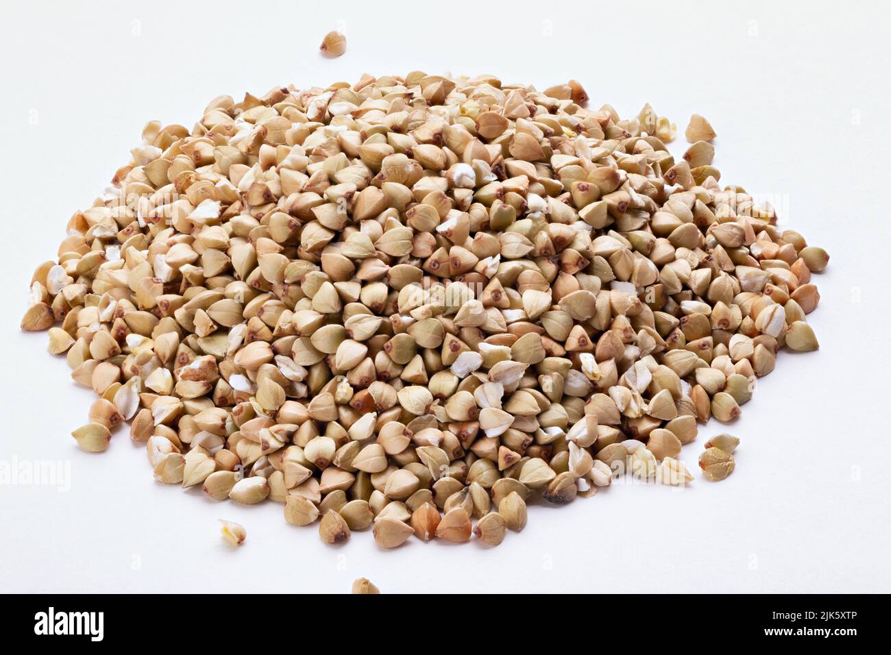Pile of buckwheat seeds isolated on white background, closeup ...