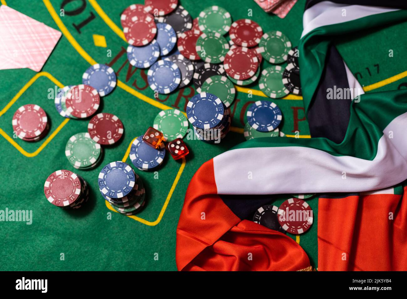 poker chips, emirates flag on blackjack table Stock Photo - Alamy