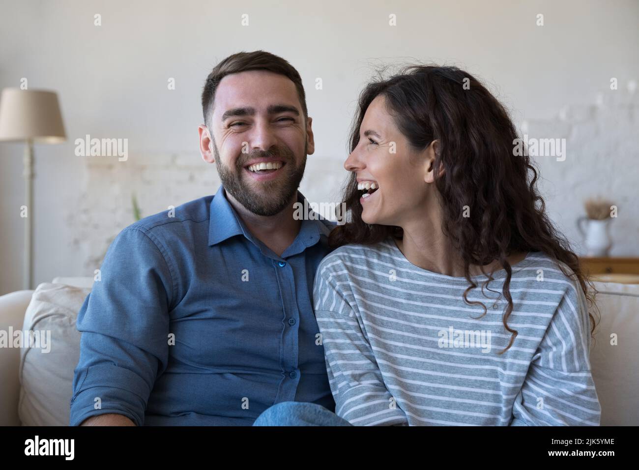 Cheerful millennial couple home head shot portrait Stock Photo - Alamy