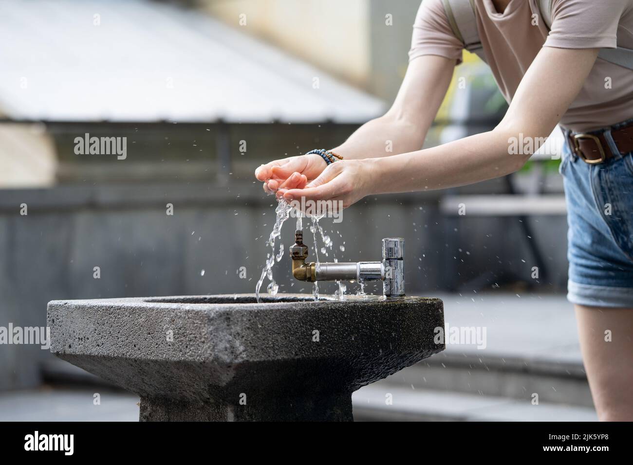 Hydration and aqua balance regulation for health. Hands with water ...