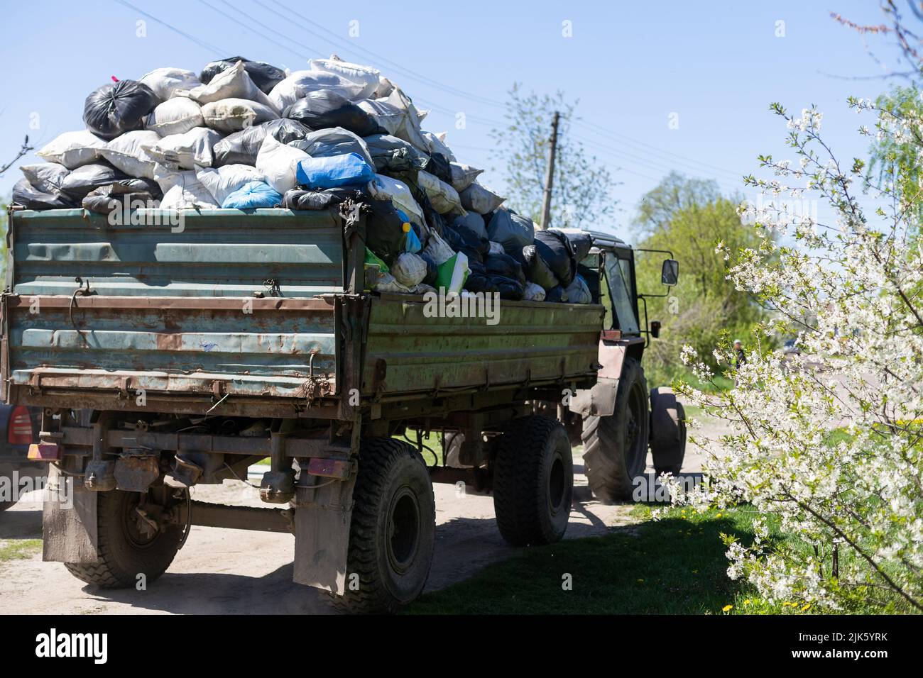 Bags with garbage in the trailer, cleaning the territory Stock Photo ...