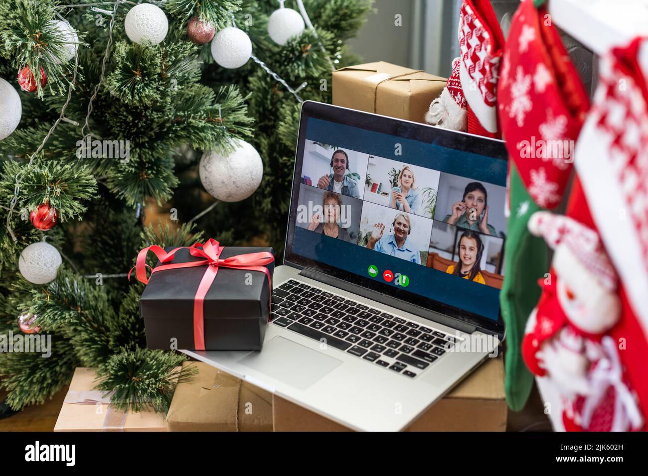 A happy family with a child is celebrating Christmas with their friends ...