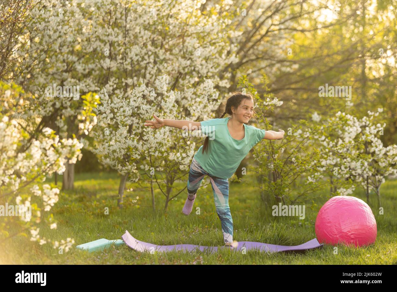 child doing gymnastics exercises. Sports, learning, fitness, stretching ...