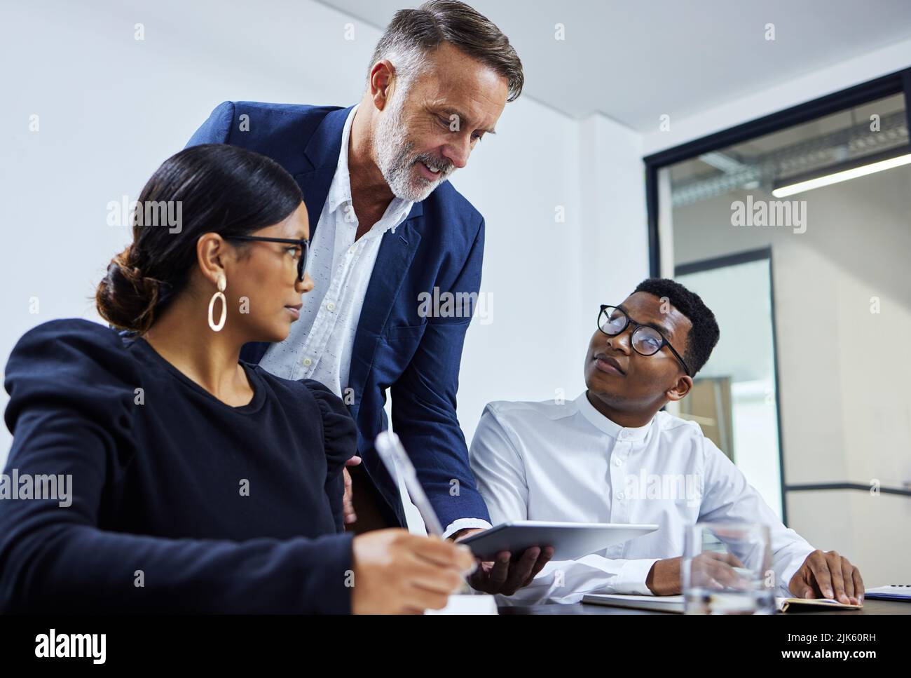 The dream team getting it all done. a group of businesspeople using a ...