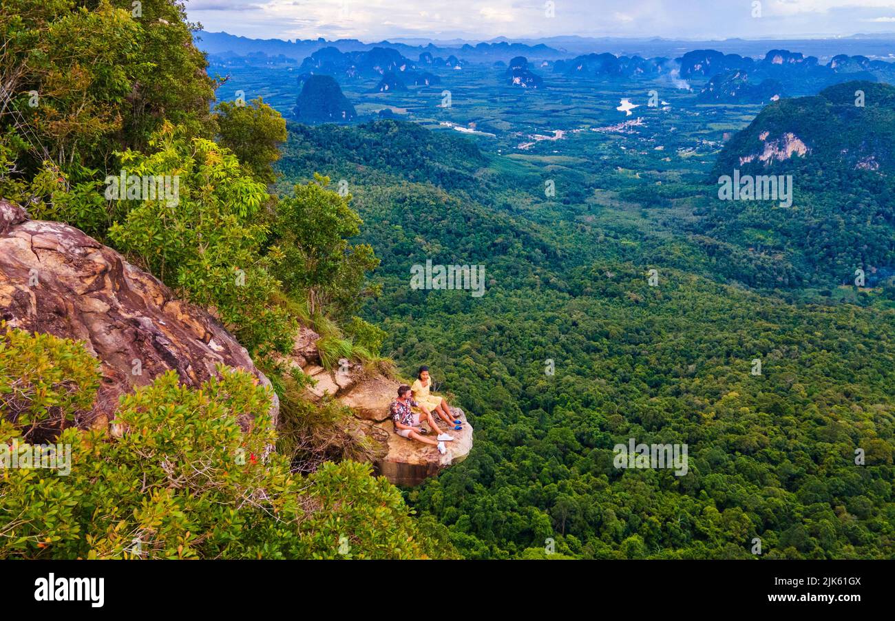 Dragon Crest mountain Krabi Thailand, a Young traveler sits on a rock ...