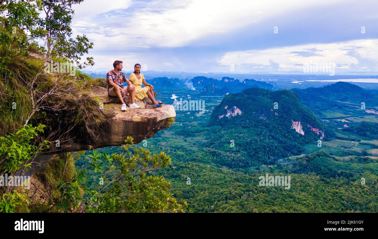 Dragon Crest mountain Krabi Thailand, a Young traveler sits on a rock ...