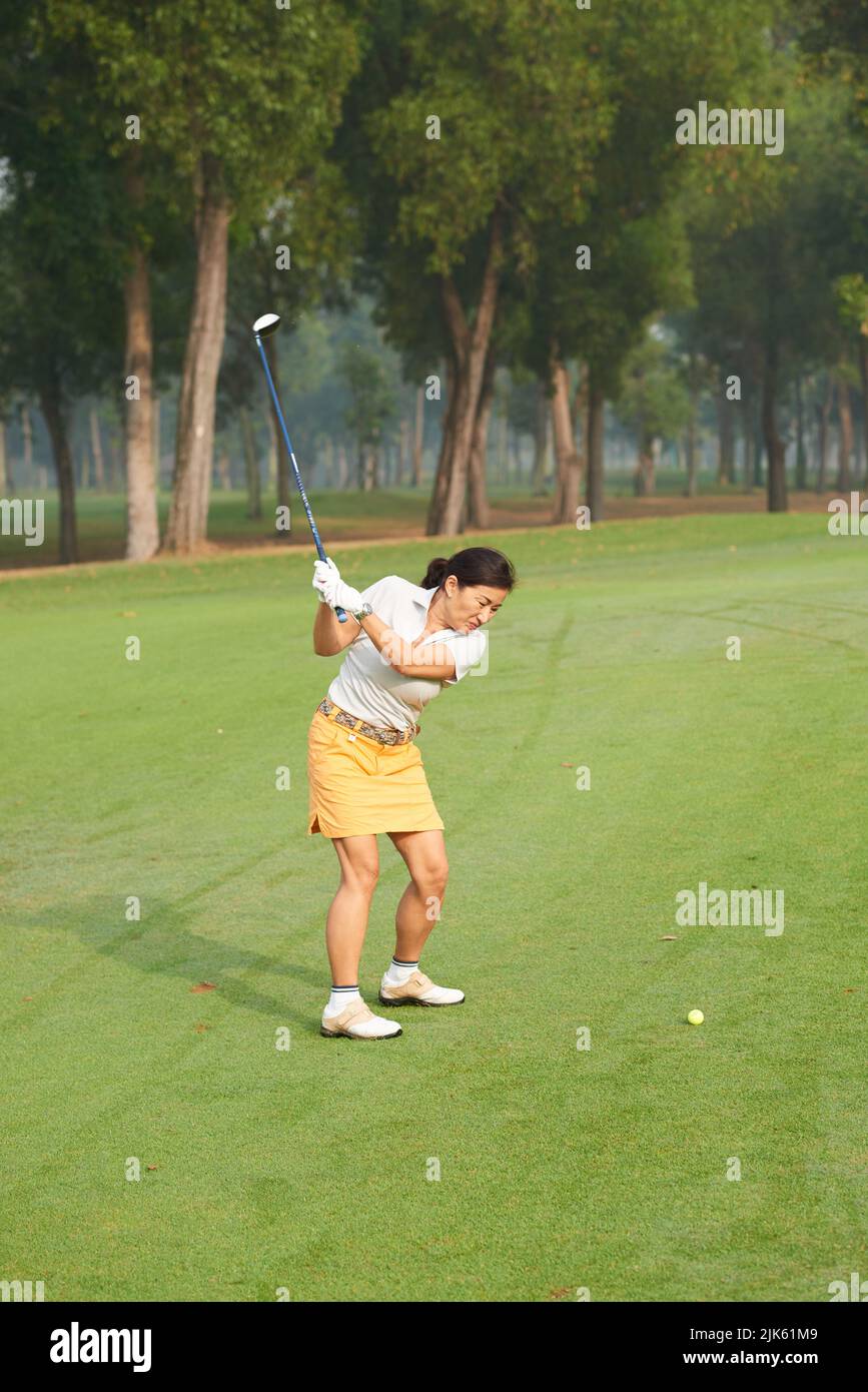 Professional Vietnamese female golfer playing on course Stock Photo - Alamy