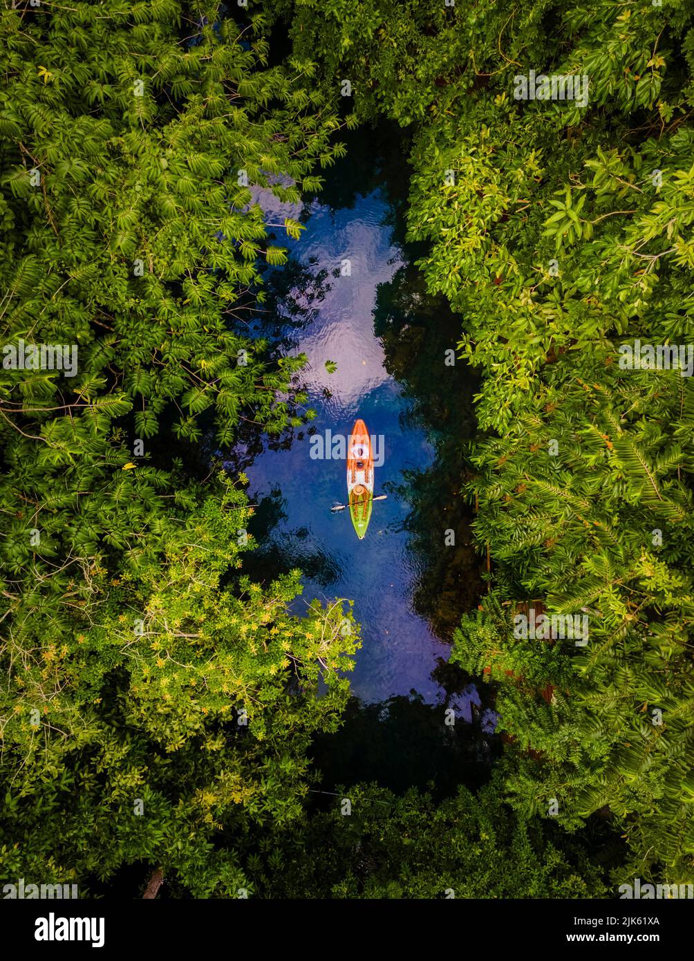 couple in a kayak in the jungle of Krabi Thailand, men and woman in ...