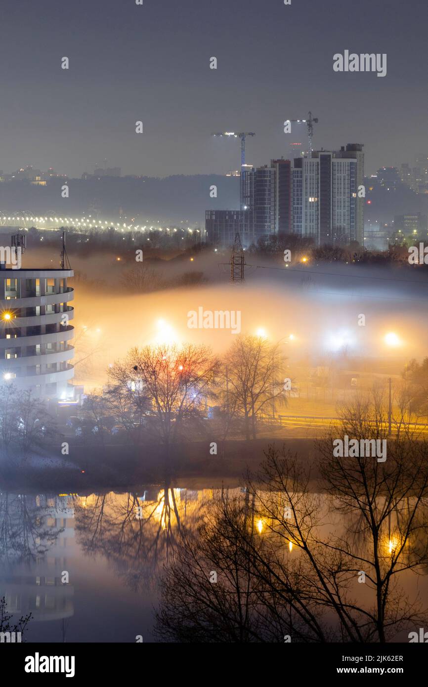 Night cityscape of the big city. Awesome bright, multi colored light in ...