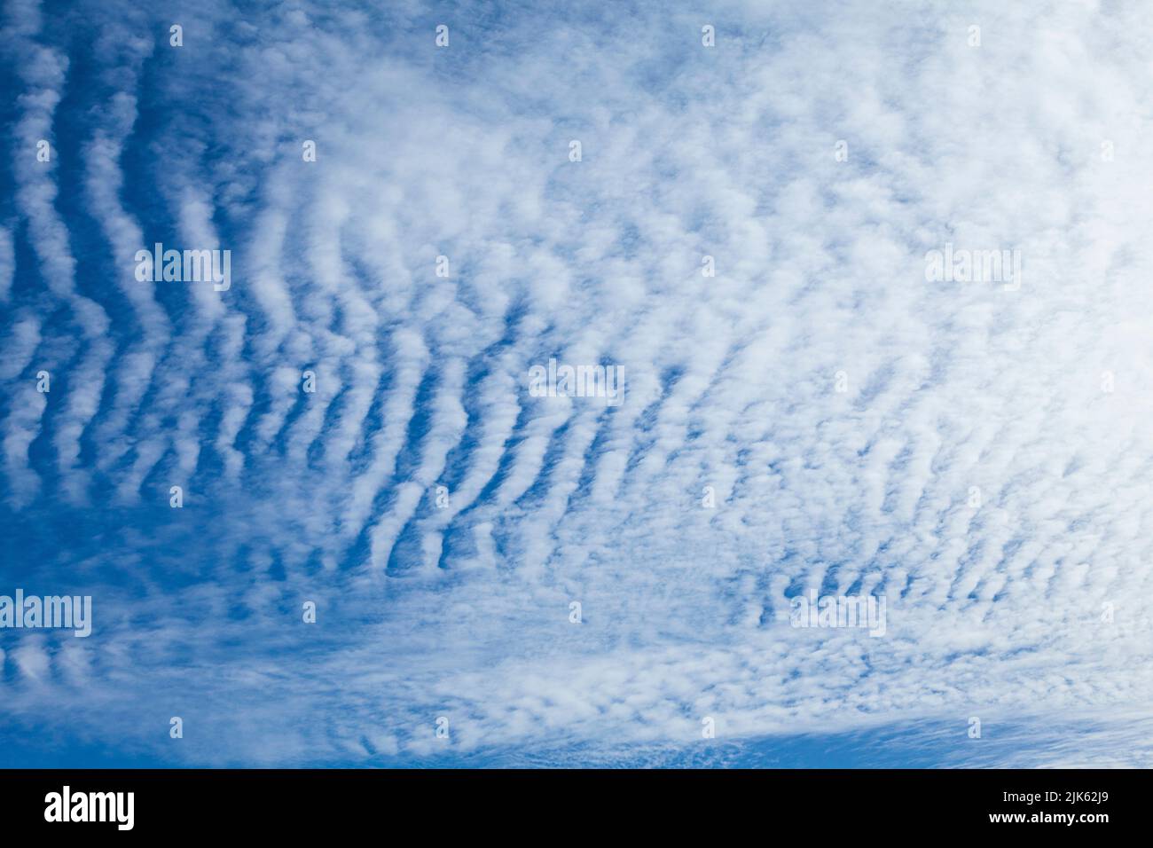 Lines of clouds in the shape of lines arranged parallel to each other ...