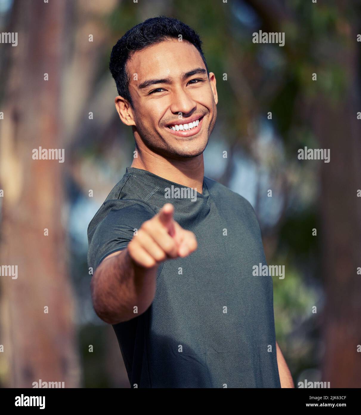 I challenge you to get your body moving. Portrait of a sporty young man ...