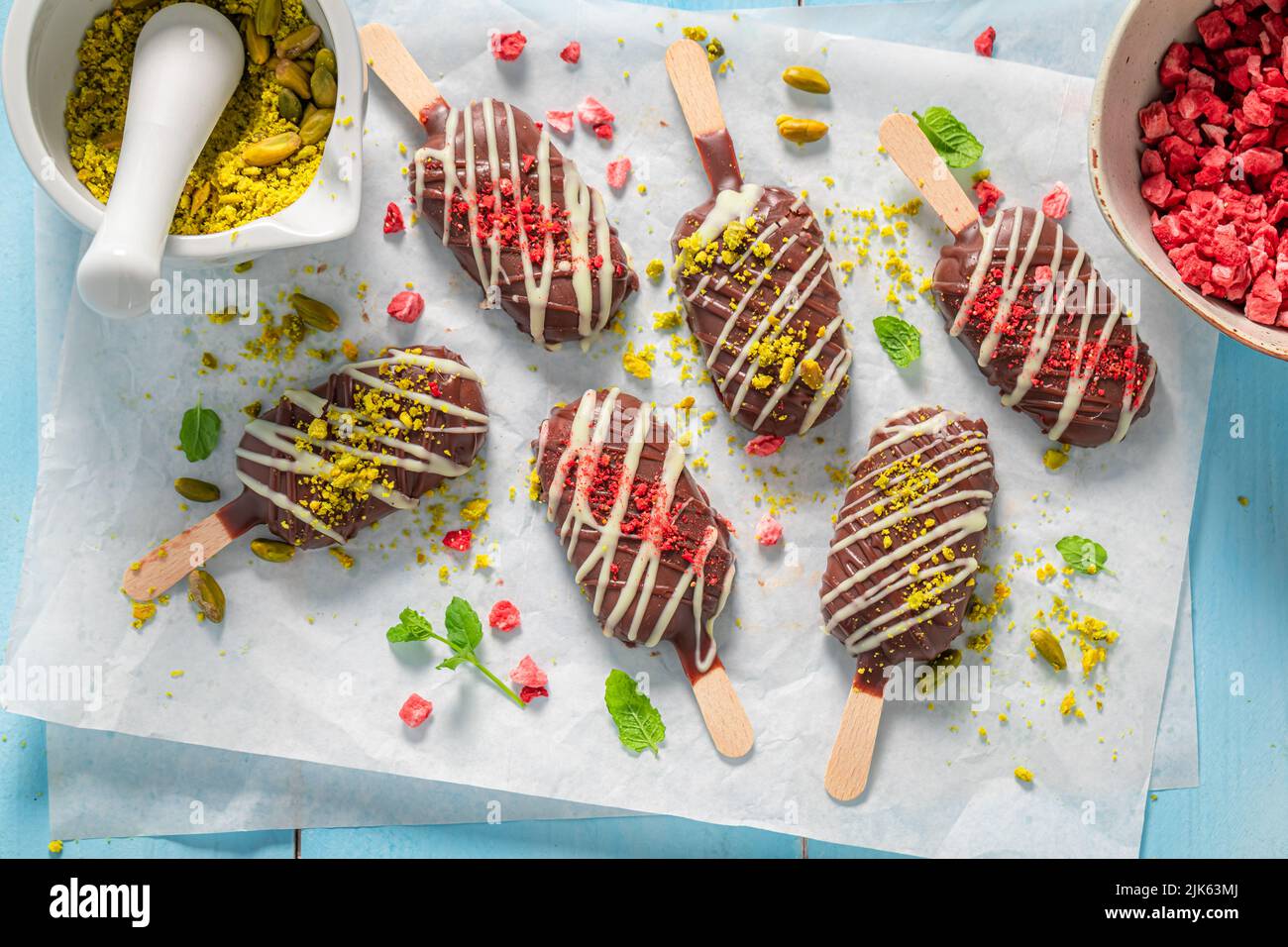 Delicious and homemade popsicles made of dark and white chocolate ...