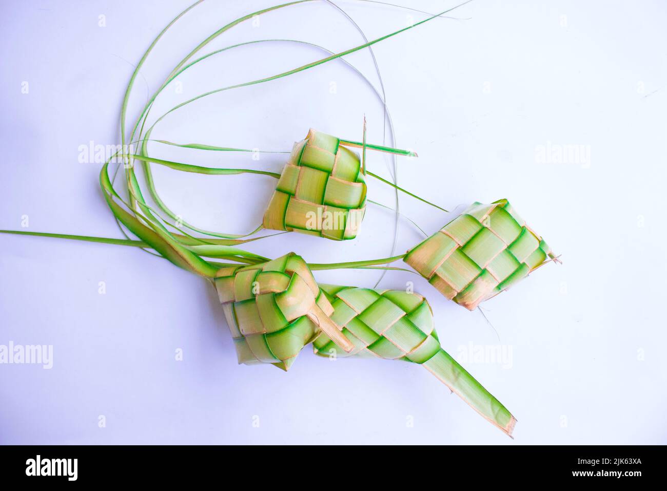 ketupat in earthenware plate isolated on white background. Ketupat ...