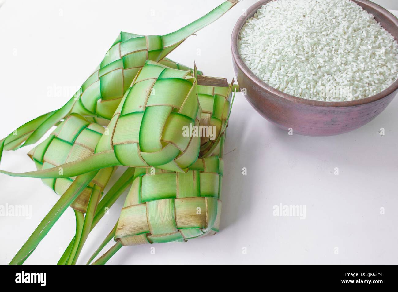 ketupat in earthenware plate isolated on white background. Ketupat ...