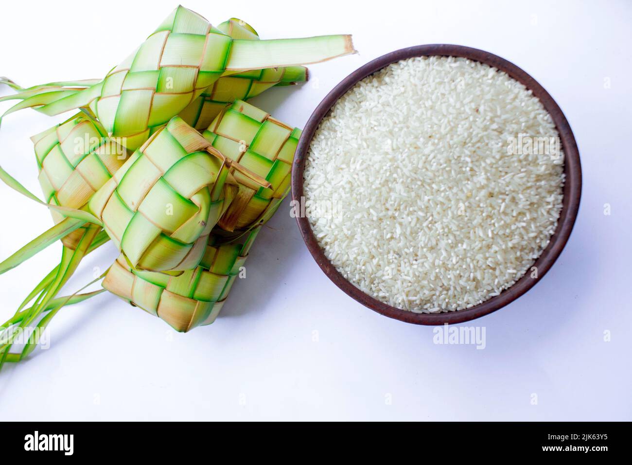 ketupat in earthenware plate isolated on white background. Ketupat ...