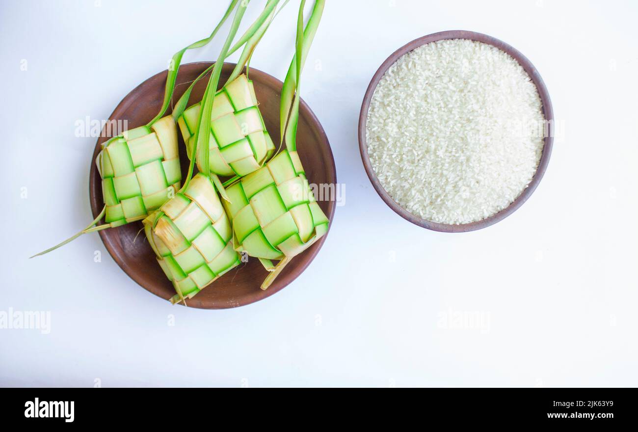 ketupat in earthenware plate isolated on white background. Ketupat ...