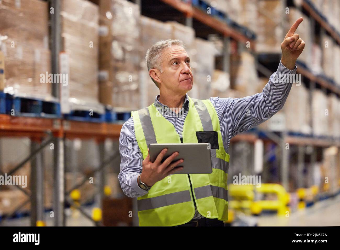 Collecting data on all current stock and merchandise. a mature man ...