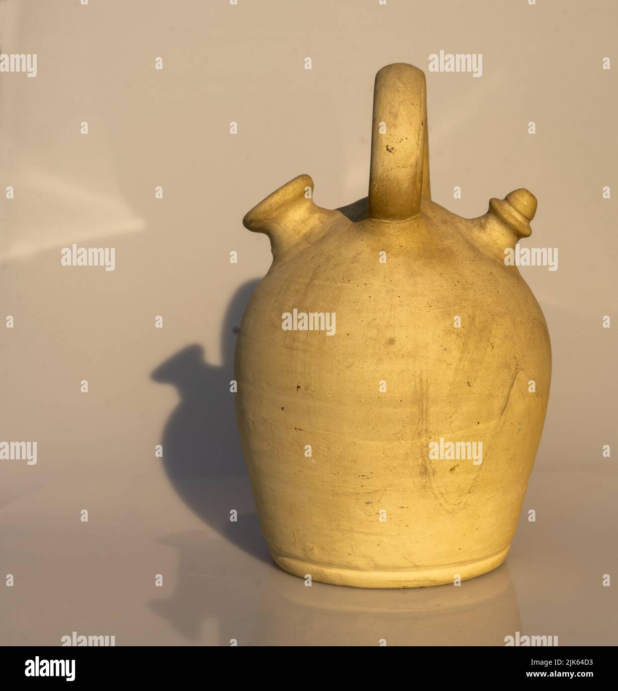 botijo in the sun on a white background Stock Photo - Alamy