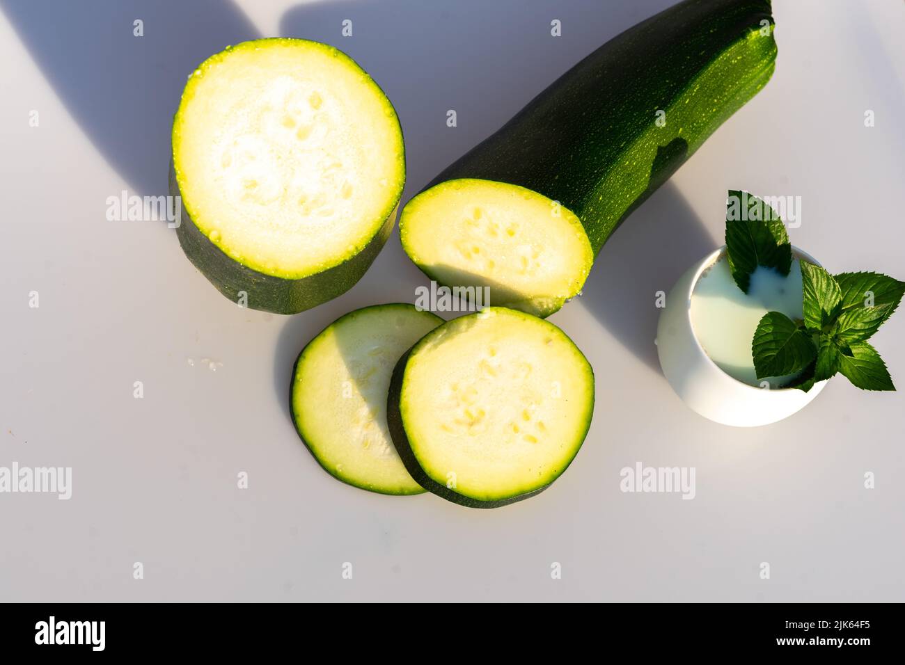 zucchini cut into halves Stock Photo - Alamy