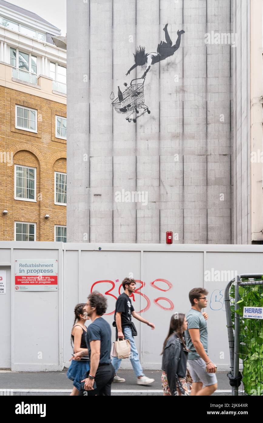 Banksy Falling Shopper, Bruton Lane, Mayfair London Stock Photo - Alamy