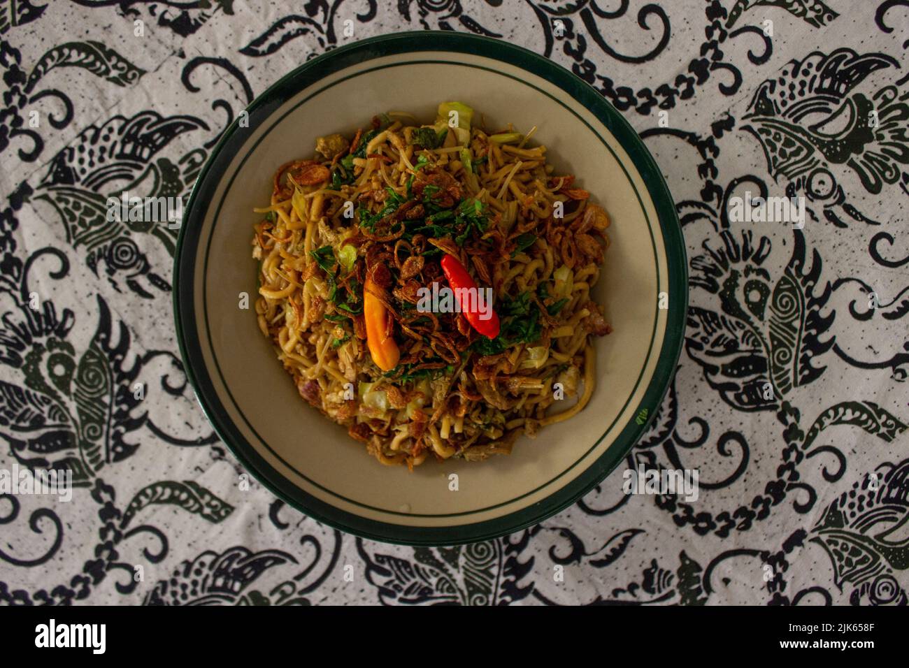 Mie Goreng Jawa or bakmi jawa or java noodle with spoon and fork ...