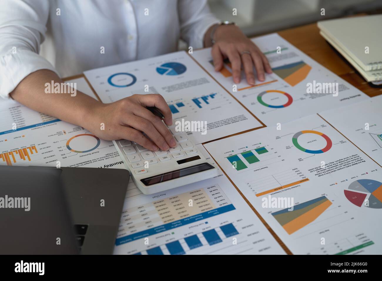 accountant banker or bookkeeper making calculations with calculator ...