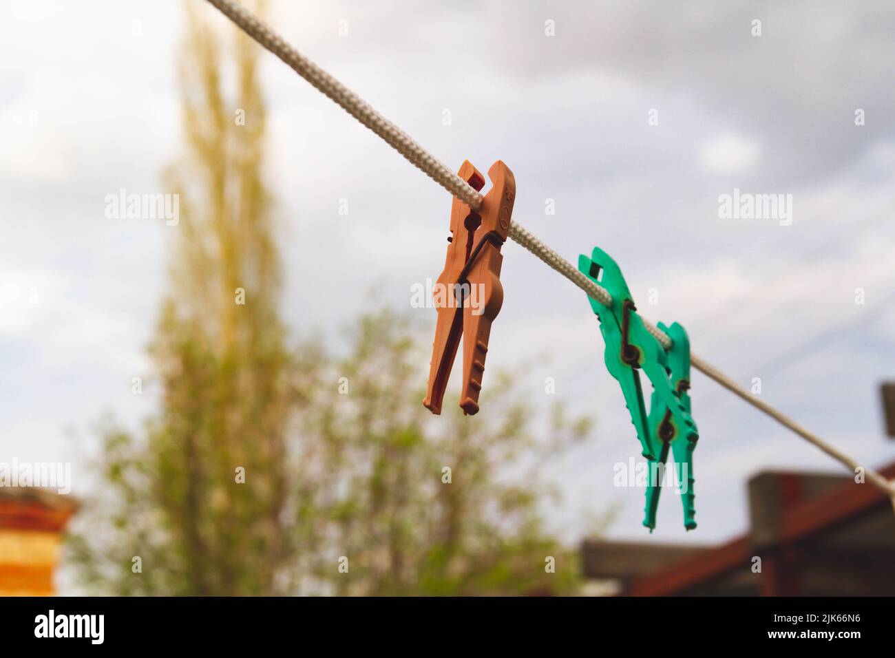 Clothespins for drying clothes on a rope. Clothesline . Laundry washing ...