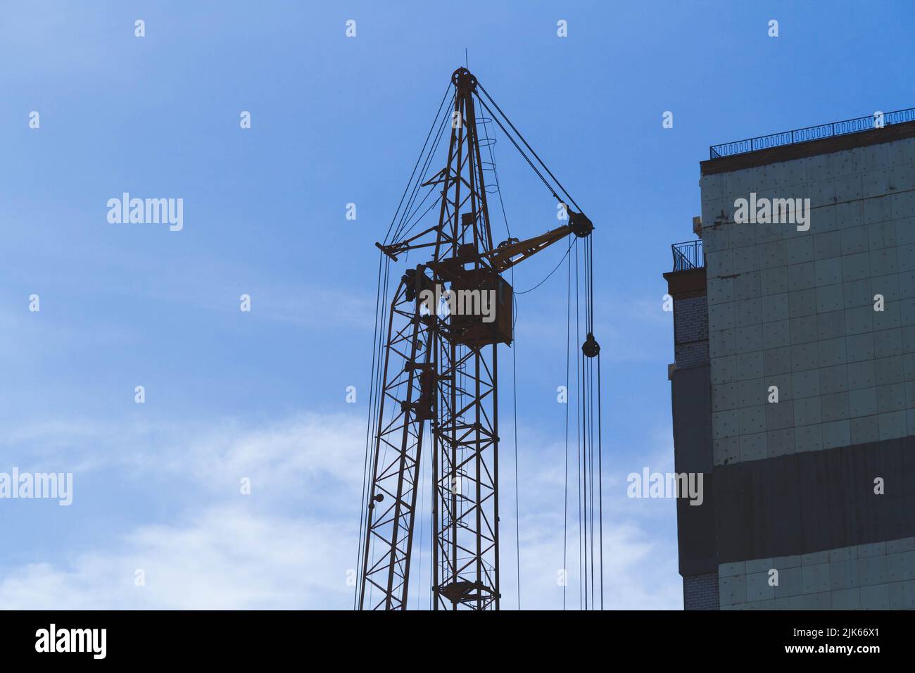 Lifting crane. Construction of high structures. Rise to height ...
