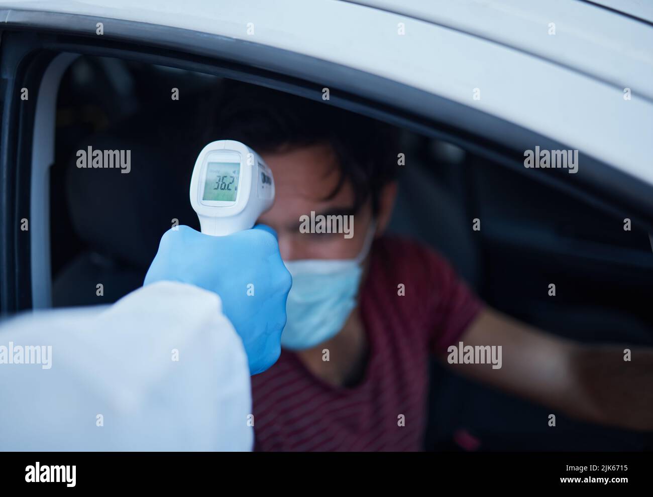 Your temperature seems to be good. a man getting his temperature taken ...