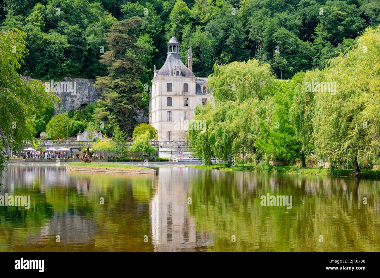 View of the Dronne river boardering the town hall (Mairie) of Brantôme ...