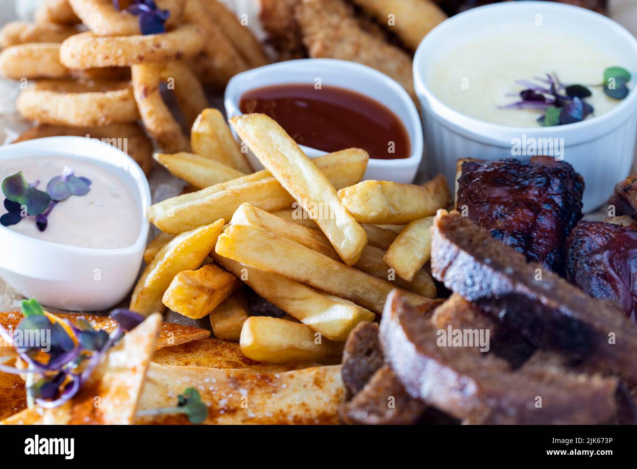 a set of different types of products fried together, French fries ...