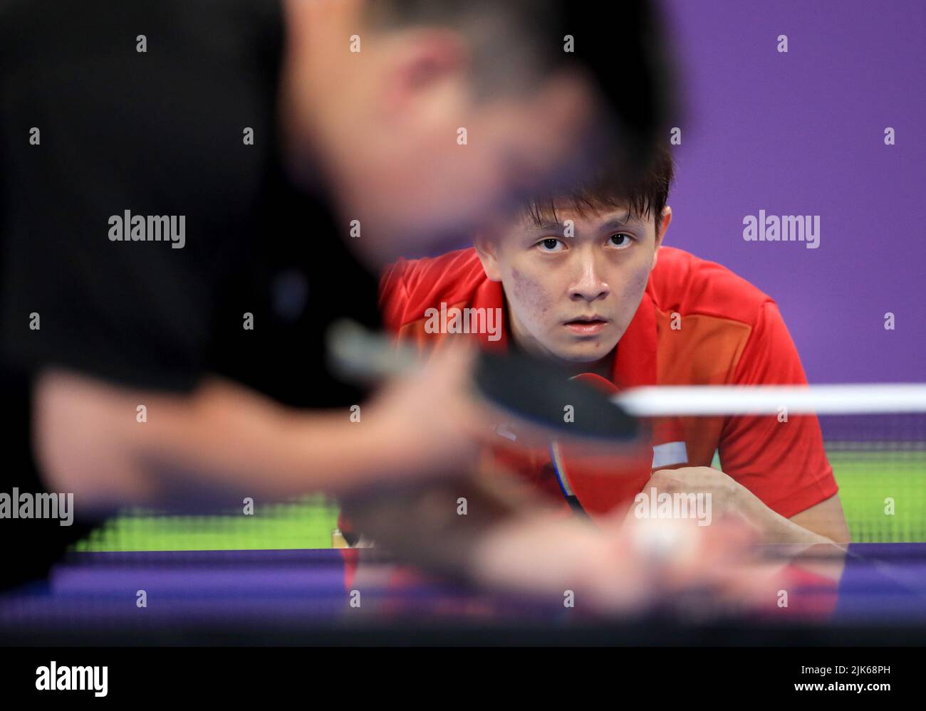 Singapore’s Zhe Yu Clarence Chew watches the serve of Canada’s Eugene ...