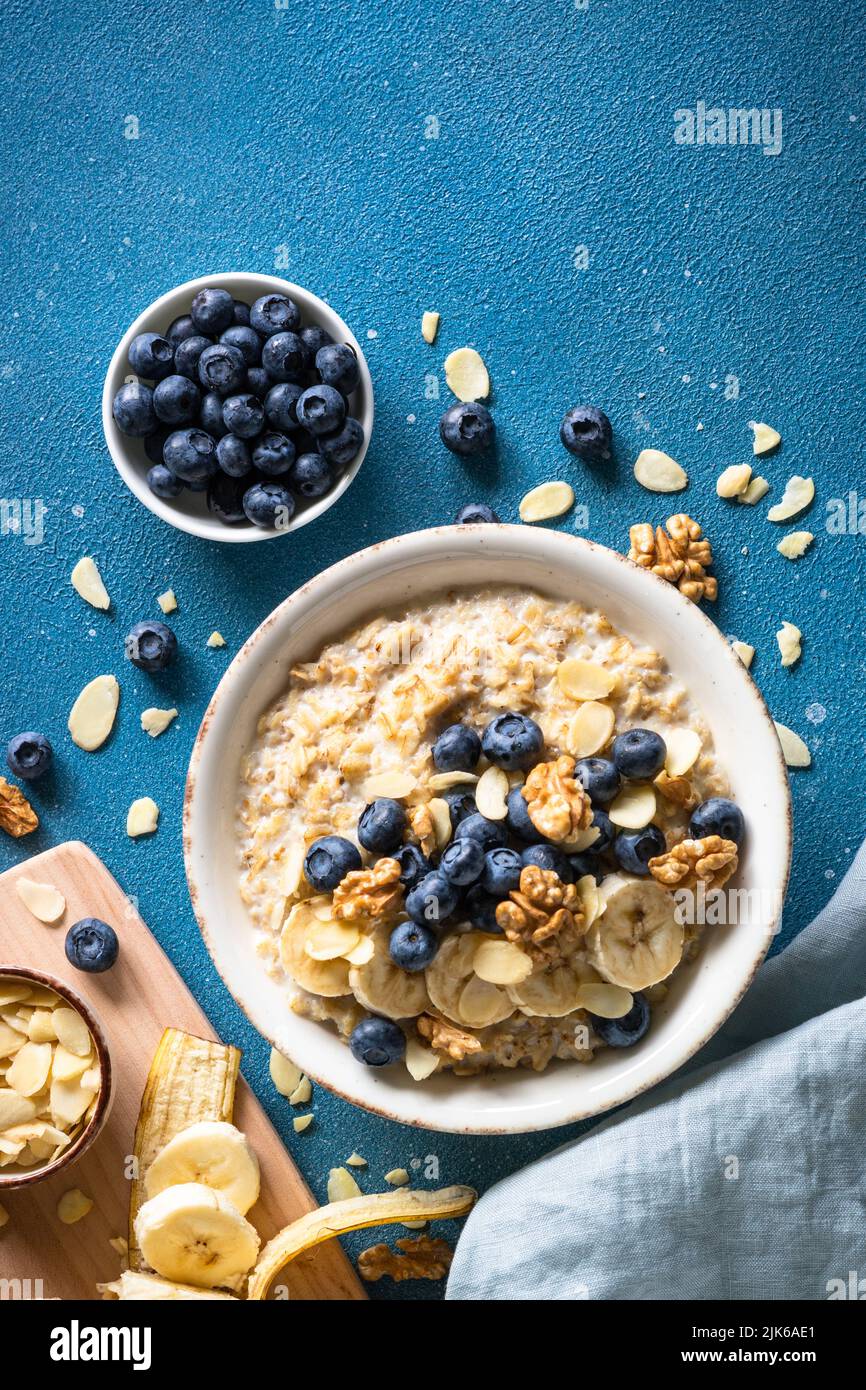 Oatmeal porrige in craft bowl at white background Stock Photo - Alamy