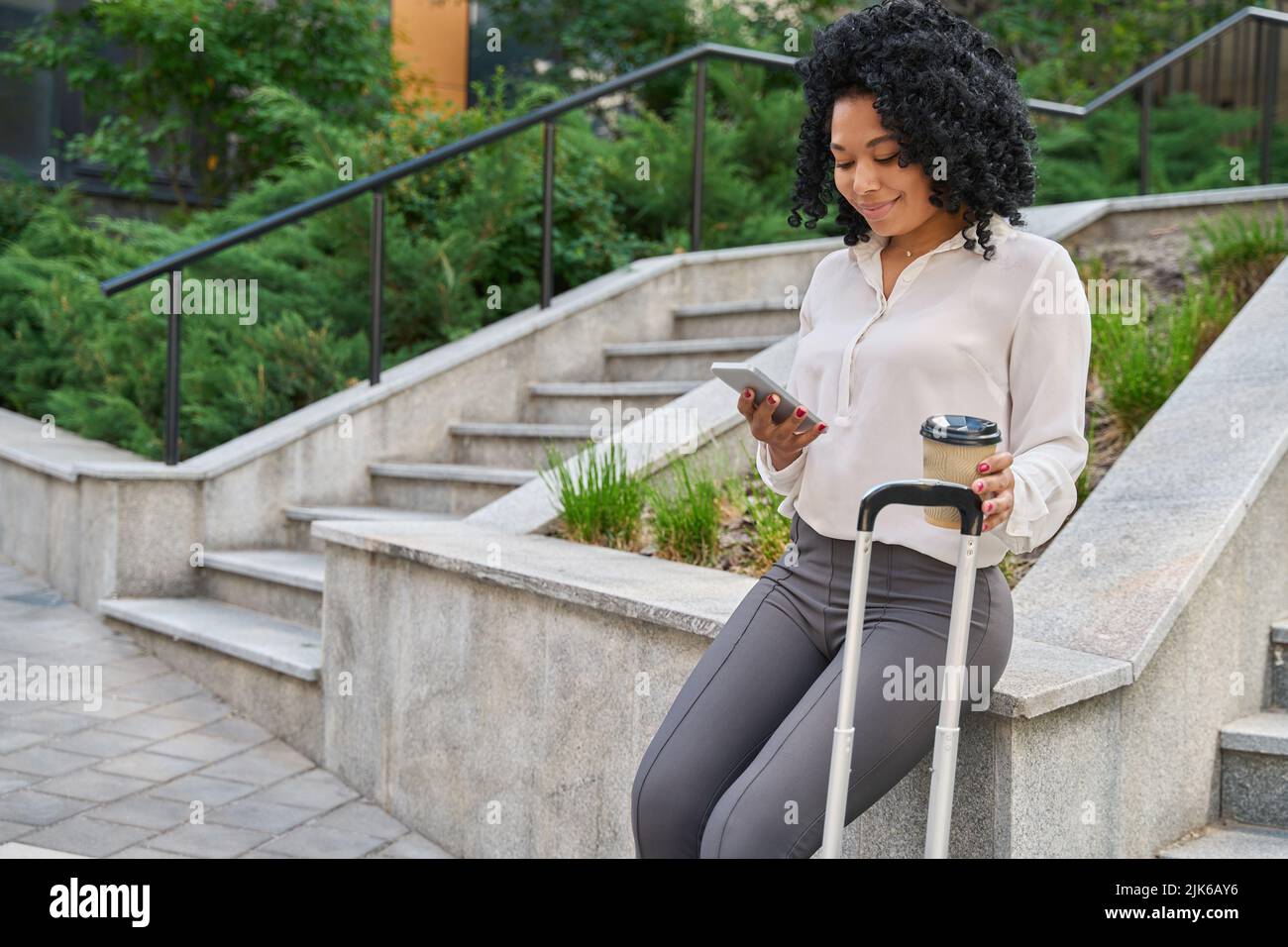 Happy friendly lady using mobile hi-res stock photography and images ...