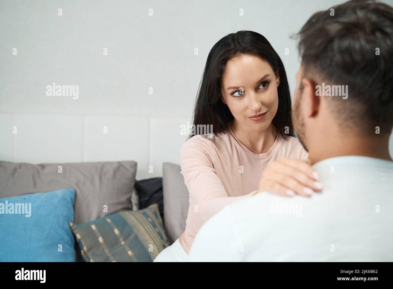 Woman looking at her boyfriend in disbelief Stock Photo - Alamy