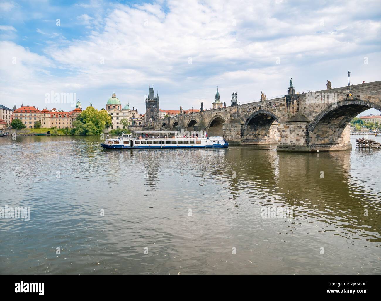 Prague, Czech Republic - June 2022: View with the Charles Bridge main touristic attraction ...