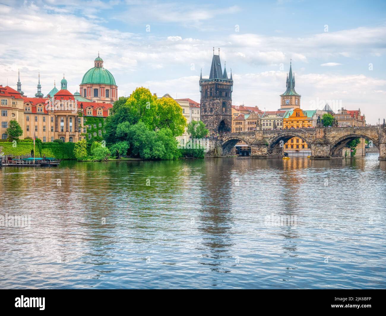Prague, Czech Republic - June 2022: View with the Charles Bridge main touristic attraction ...
