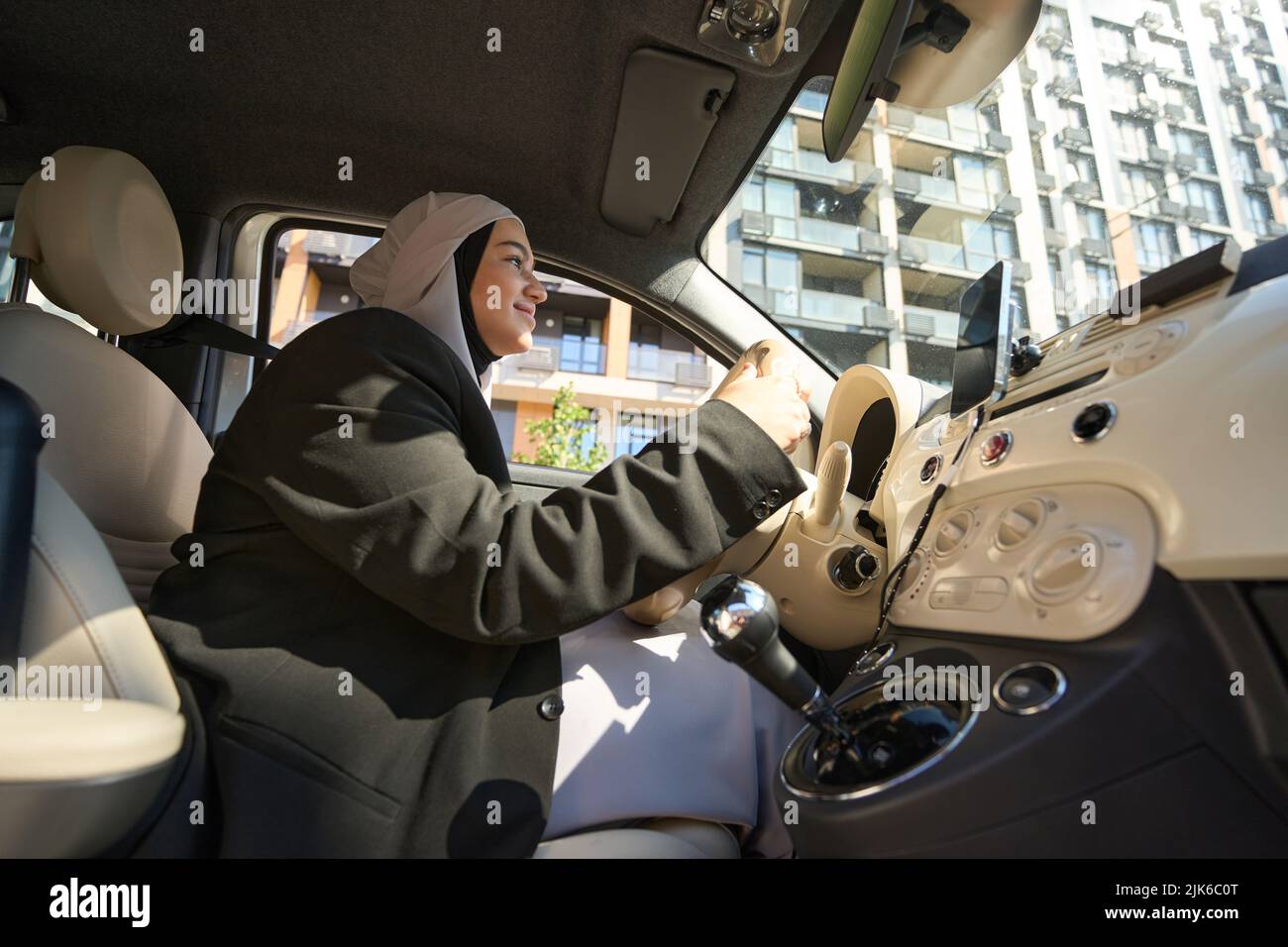 Side view of Arab woman carefully drives a car Stock Photo - Alamy