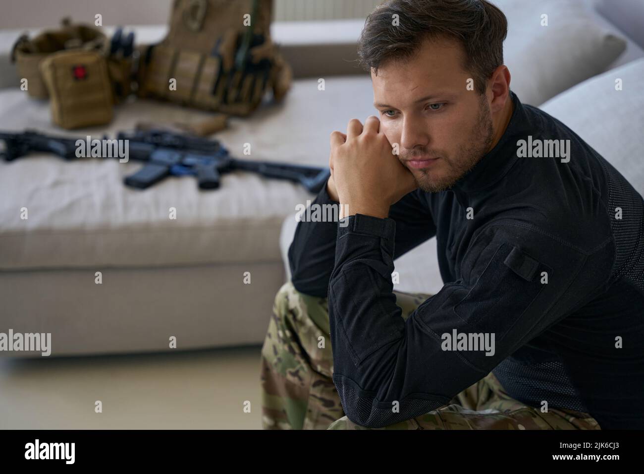 Stressed male soldier on leave at home from war Stock Photo - Alamy