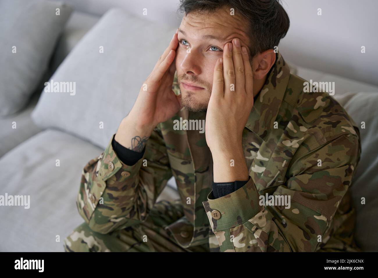 Military serviceman at home having post traumatic stress syndrom Stock ...