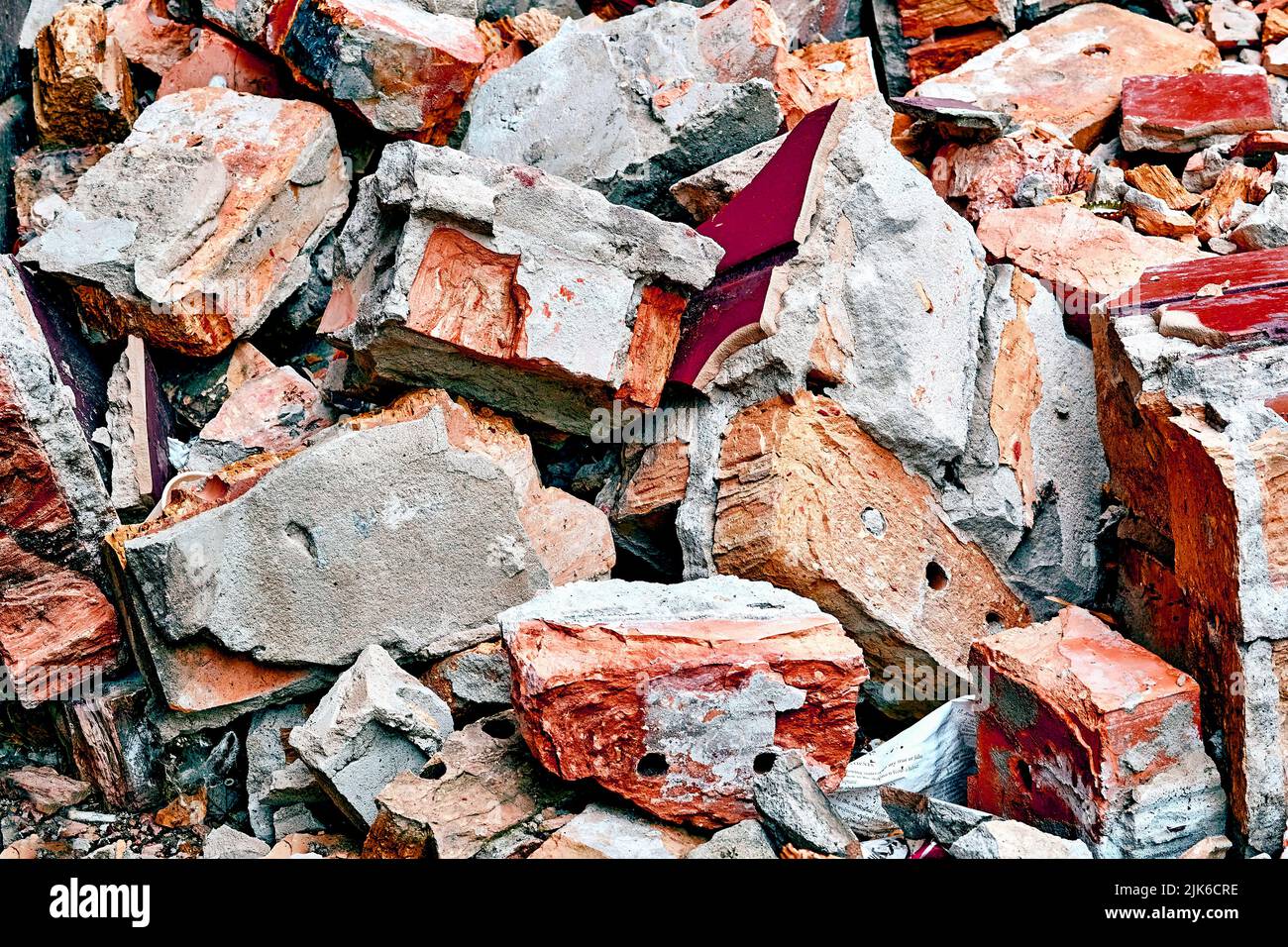 After the disaster. A pile of red brick fragments left after the ...