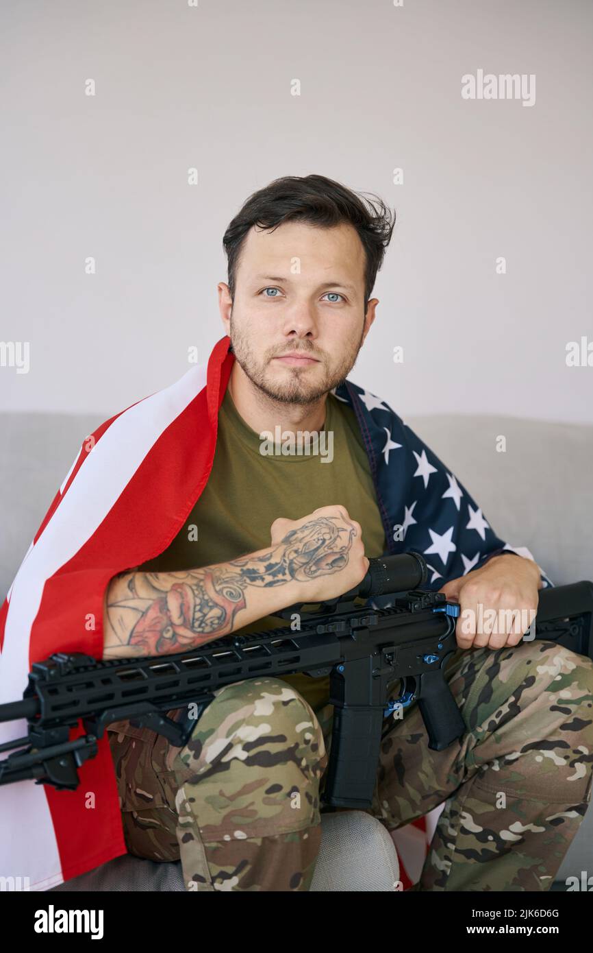 Person with firearm in home hi-res stock photography and images - Alamy