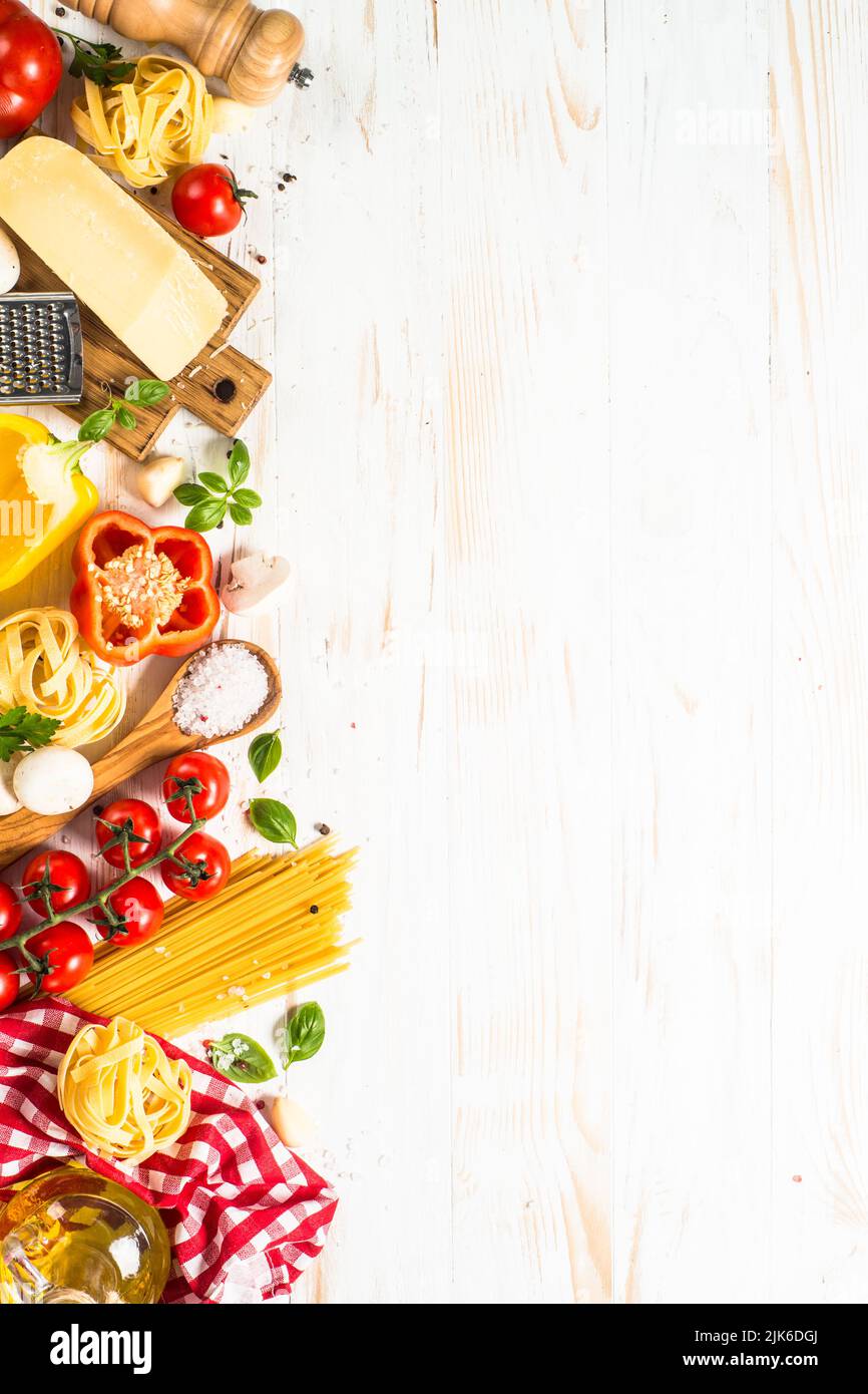 Italian food background at white bkitchen table Stock Photo - Alamy