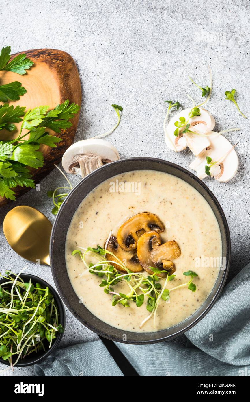 Mushroom Soup on light stone table. Champignon cream soup Stock Photo ...