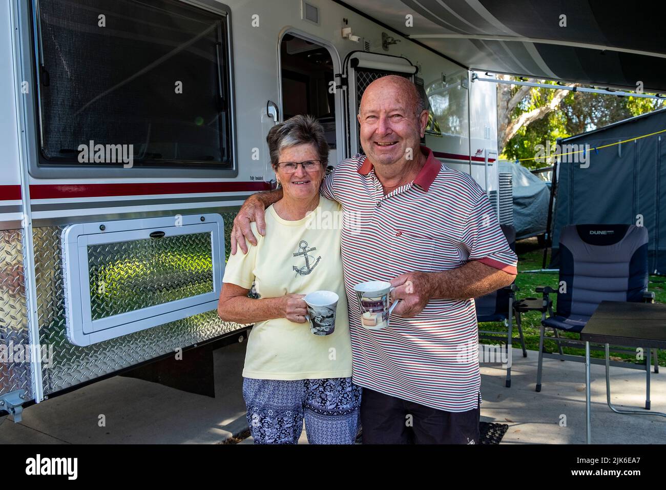 Happy retired couple camping with their luxury caravan at Mudjimba ...