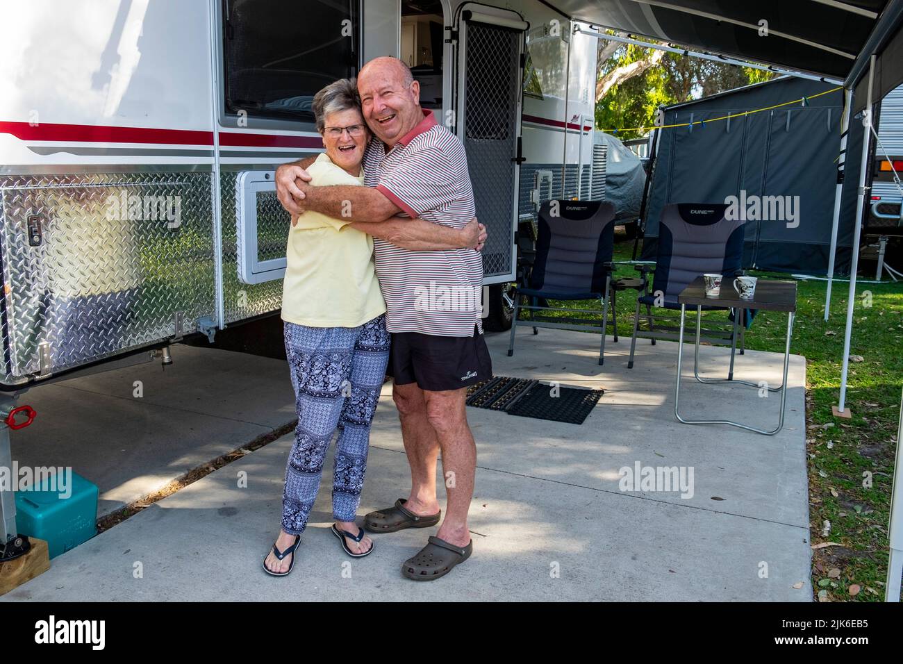 Happy retired couple camping with their luxury caravan at Mudjimba ...