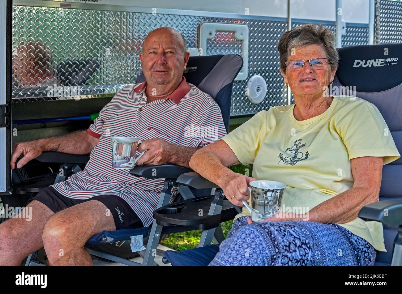 Happy retired couple camping with their luxury caravan at Mudjimba ...